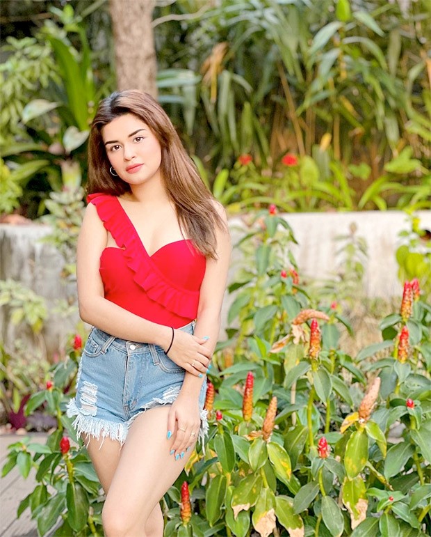 Avneet Kaur sizzles in flaming red one-shoulder monokini and shorts as ...