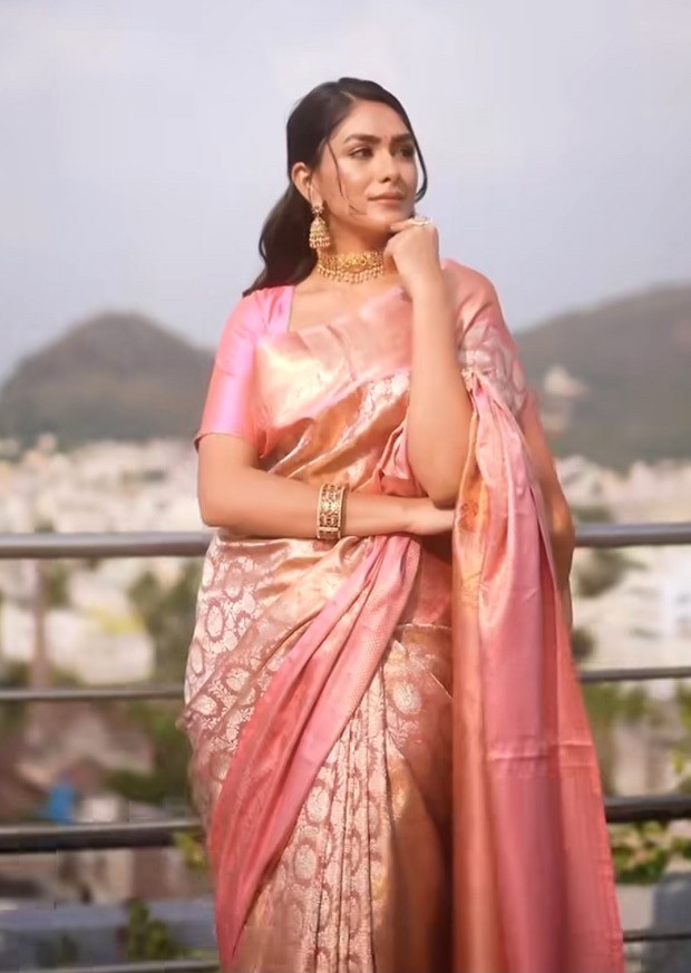 Mrunal Thakur, dressed in a blush pink brocade saree and with gajra in ...