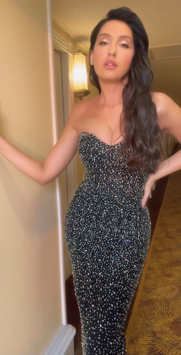 Nora Fatehi exudes glitz and glam in body-con fit shimmery gown ...