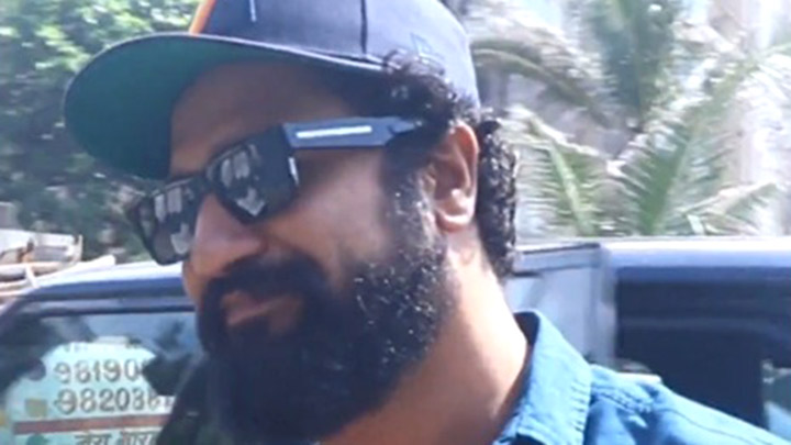 Vicky Kaushal poses with fans in a blue shirt & scruffy beard ...